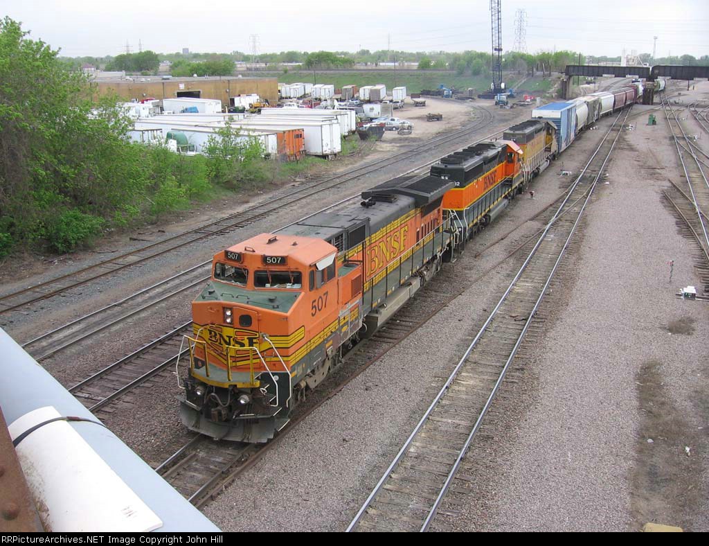 07050405 Eastbound BNSF freight departs Northtown Yard on the South Runner at CTC 35th
